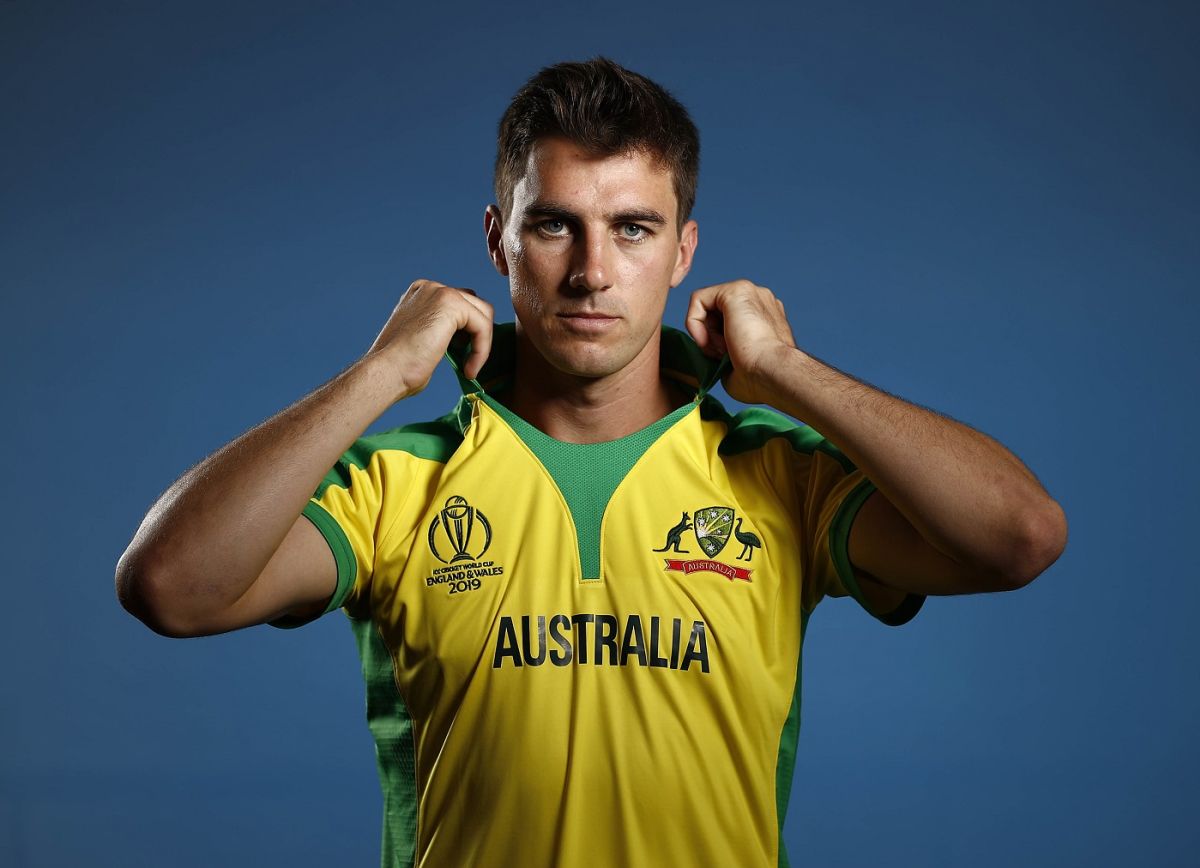 Pat Cummins poses during a photo session | ESPNcricinfo.com