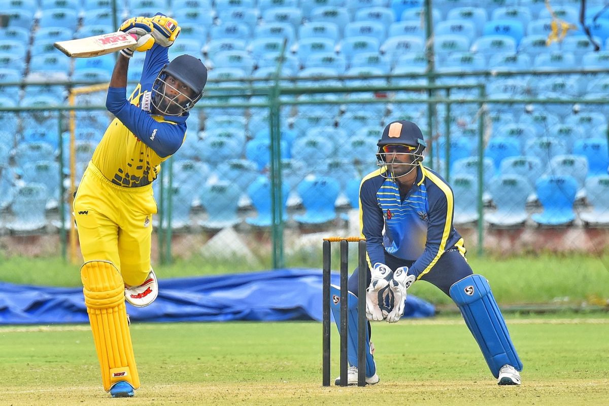 C Hari Nishaanth chips one down the ground as Nakul Verma looks on | ESPNcricinfo.com