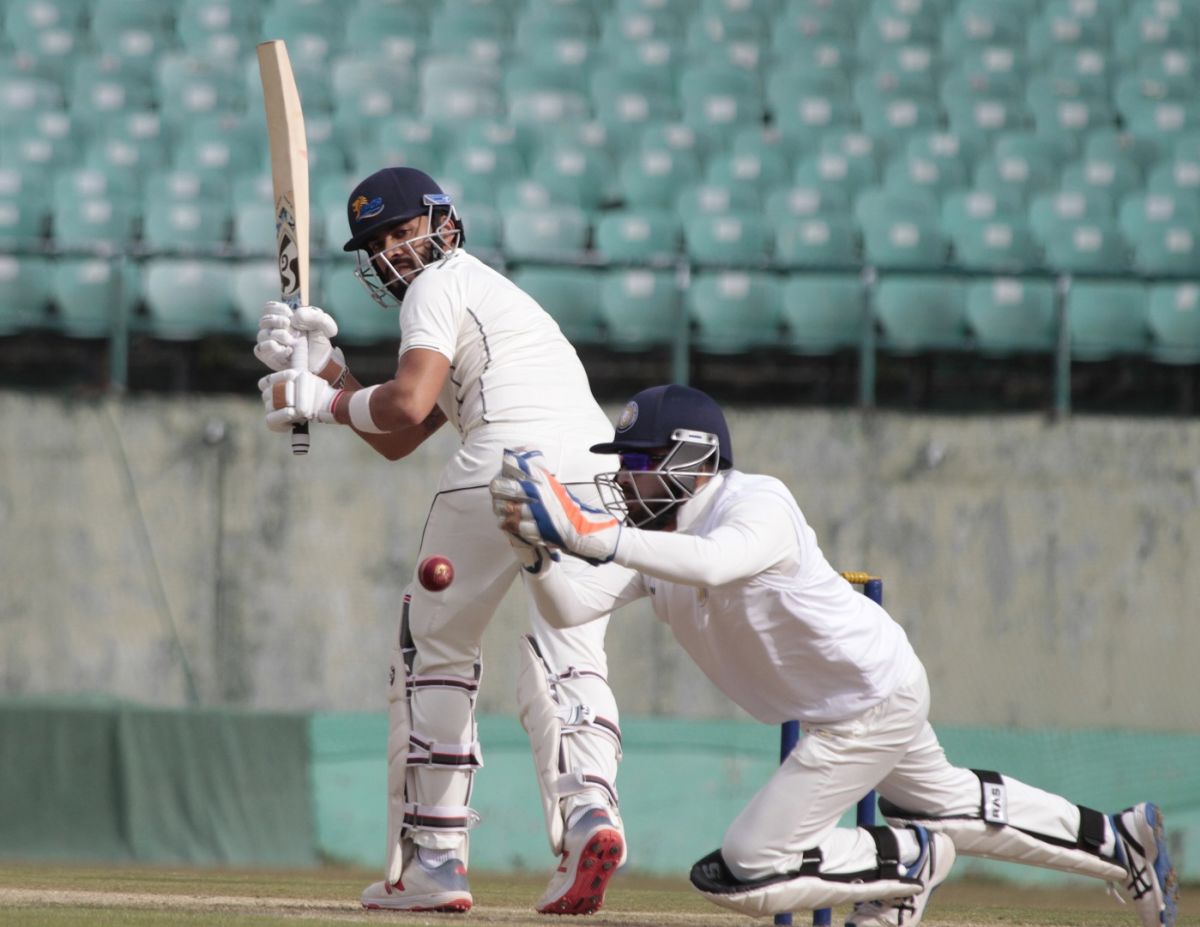 Prashant Chopra raises his bat after reaching 300 | ESPNcricinfo.com