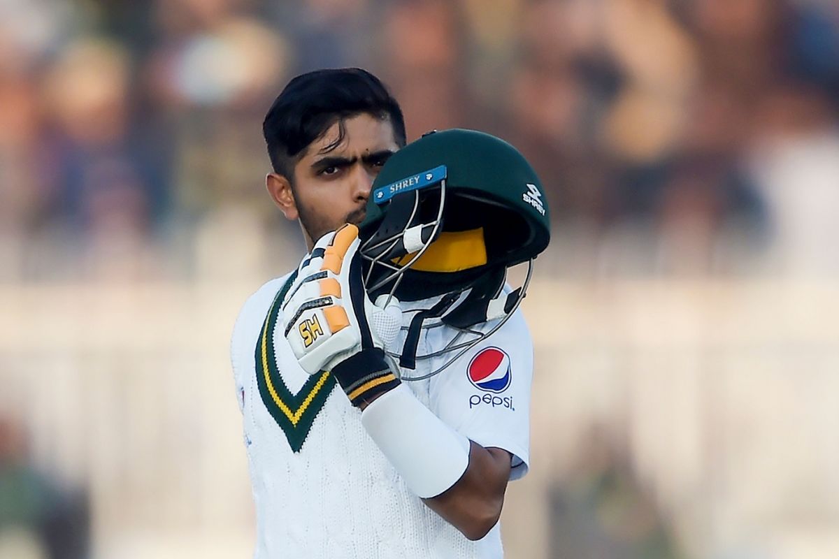 Babar Azam kisses the badge on his helmet | ESPNcricinfo.com