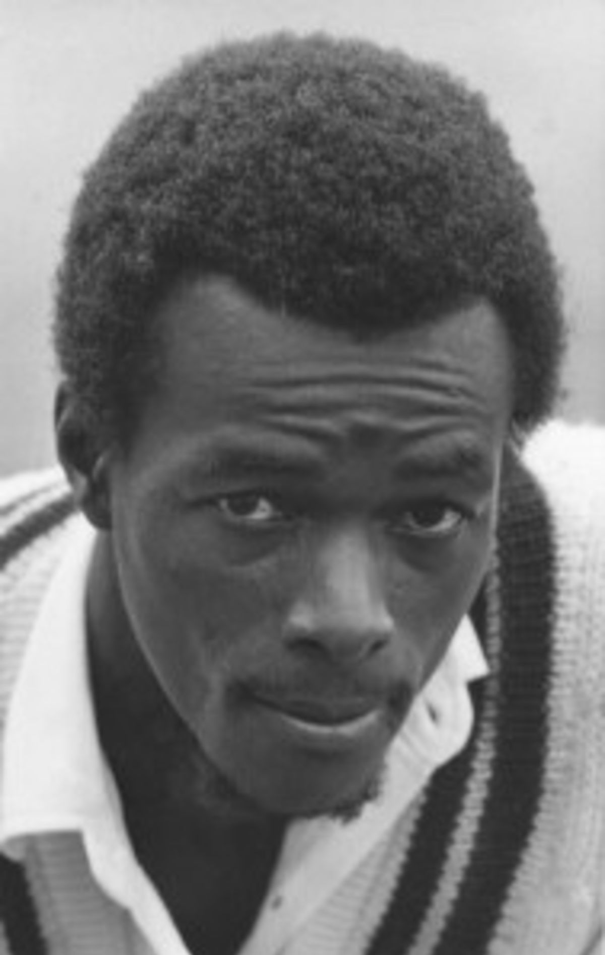 Ian Botham tries to figure out a way to pack all his bags in his small ...