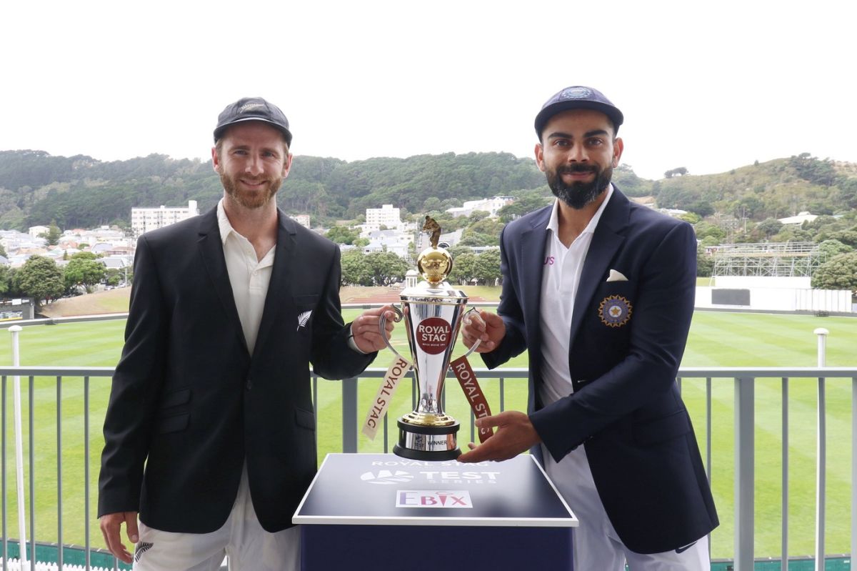 Kane Williamson and Virat Kohli pose with the trophy | ESPNcricinfo.com