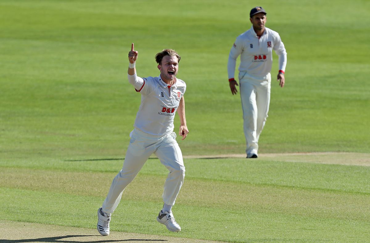 Sam Cook goes up in celebration | ESPNcricinfo.com