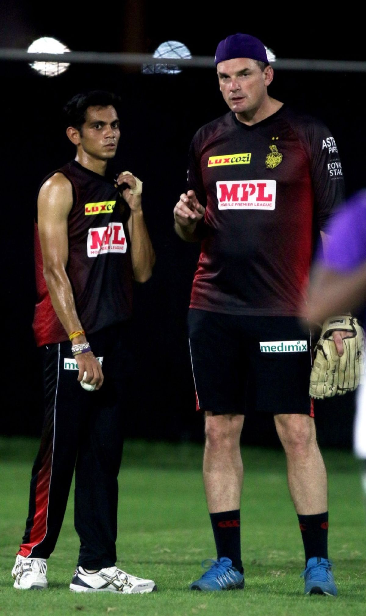 Kyle Mills shares a point with Kamlesh Nagarkoti | ESPNcricinfo.com