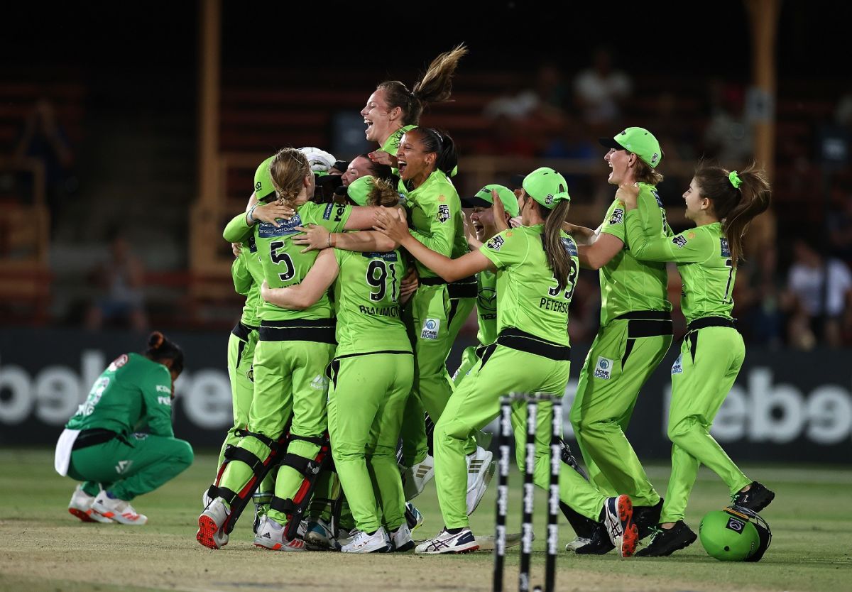The Sydney Thunder players celebrate winning the WBBL 2020 title ...