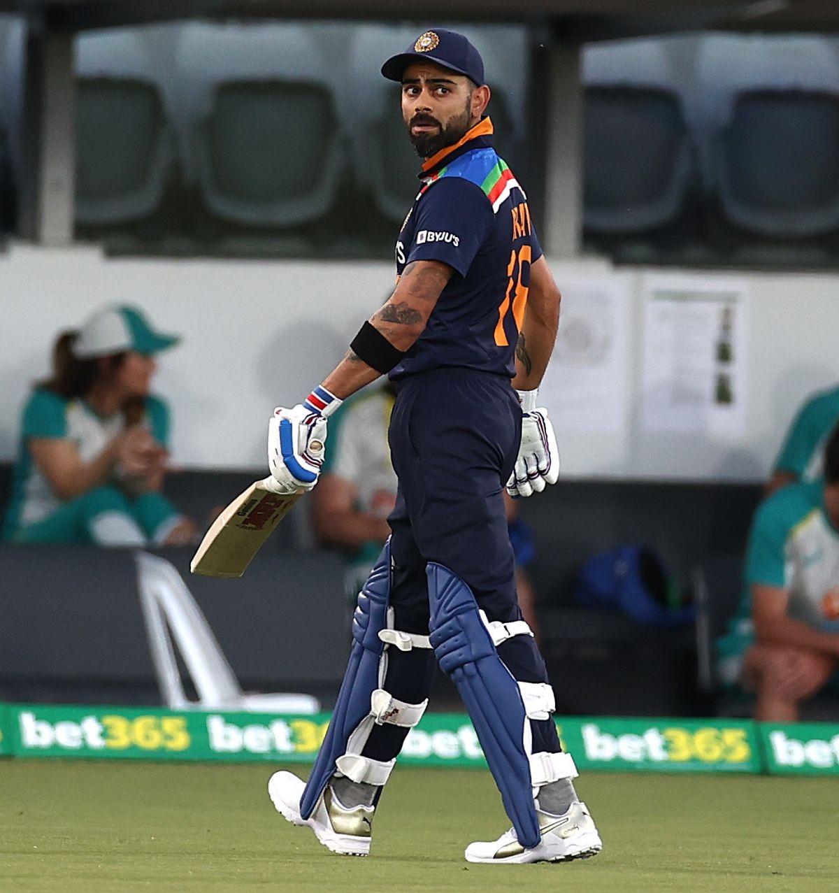 Virat Kohli walks back after being dismissed by Mitchell Swepson | ESPNcricinfo.com