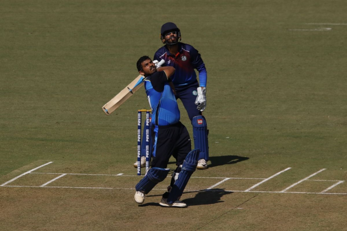 Mohammed Azharuddeen poses after his century | ESPNcricinfo.com