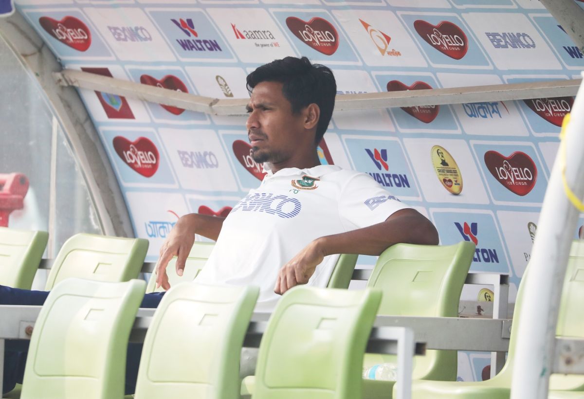 Mustafizur Rahman looks on from the sidelines | ESPNcricinfo.com