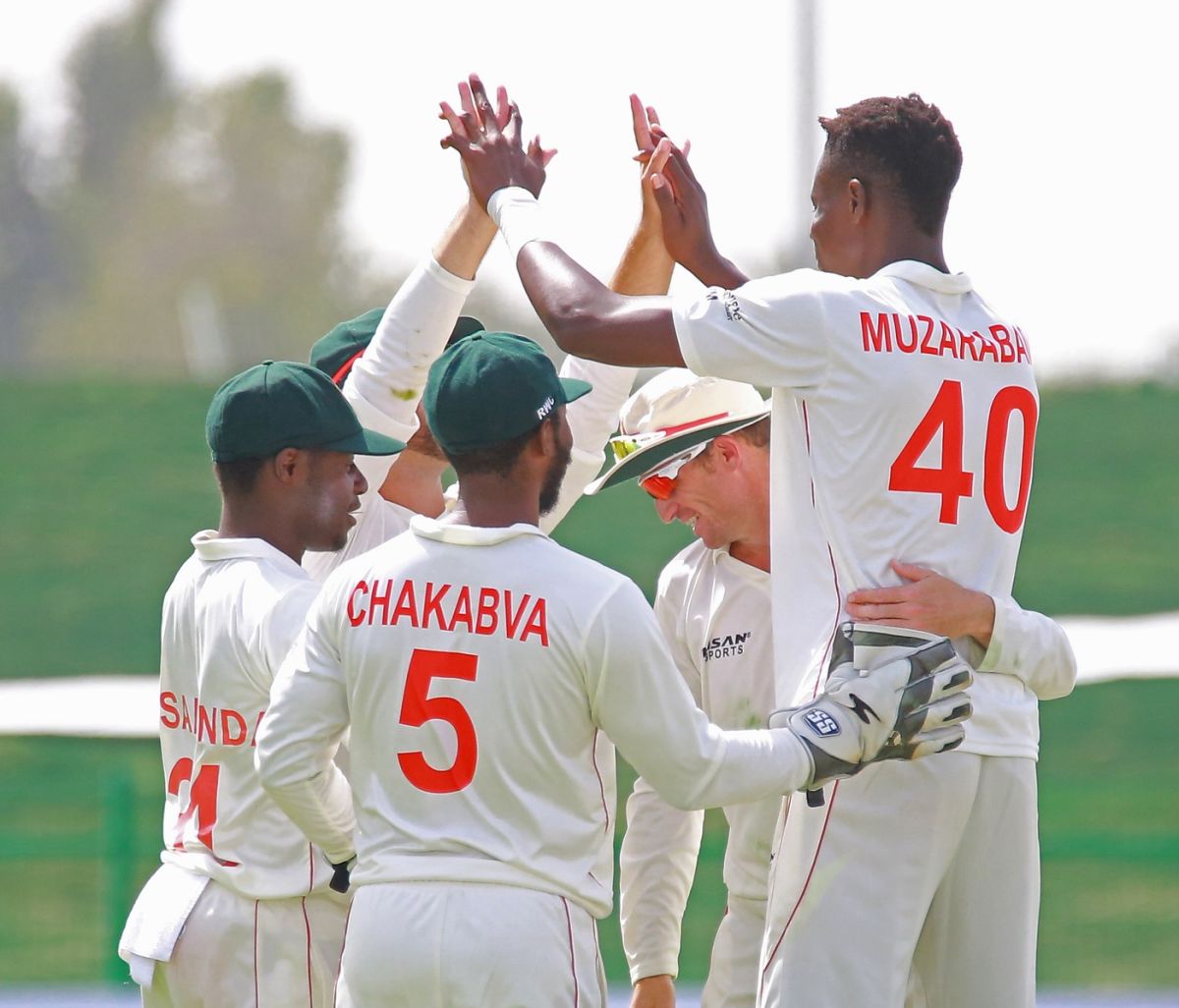Blessing Muzarabani celebrates a wicket with his team-mates ...