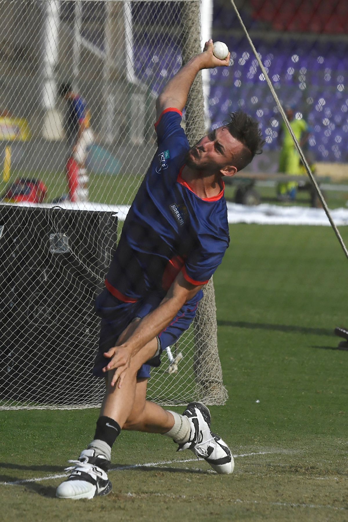 Aaron Summers bowls during a Karachi Kings training session ...