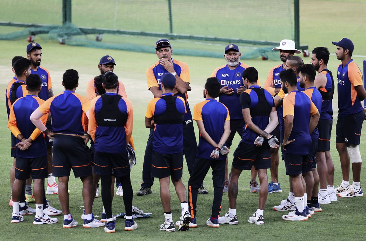 India players and coaches have a discussion during training ...