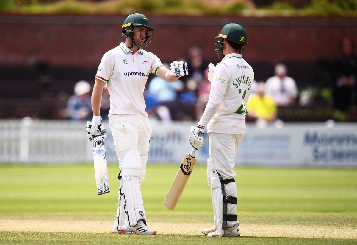 Colin Ackermann celebrates with Harry Swindells after reaching his half ...