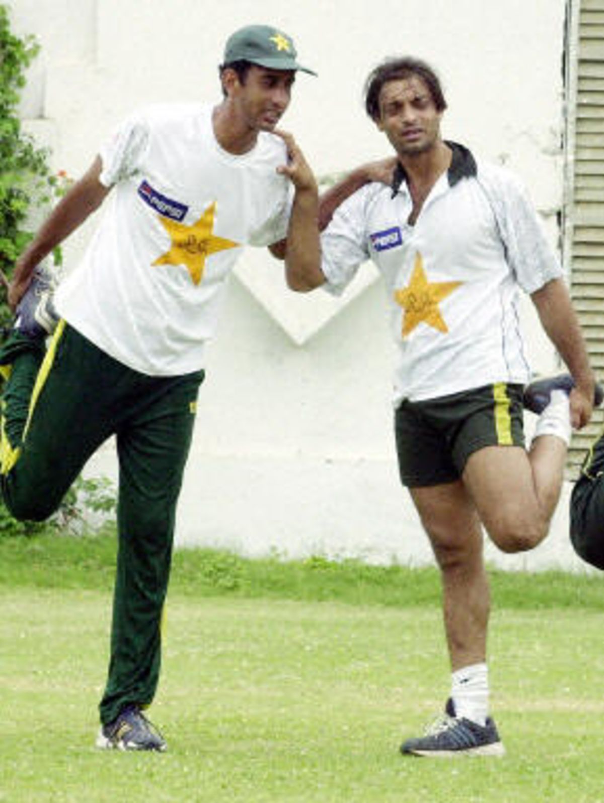 Pakistan cricketers Shoaib Akhtar (R) and Shabbir Ahmed stretch before ... Pakistan cricketers Shoaib Akhtar (R) and Shabbir Ahmed stretch before ...