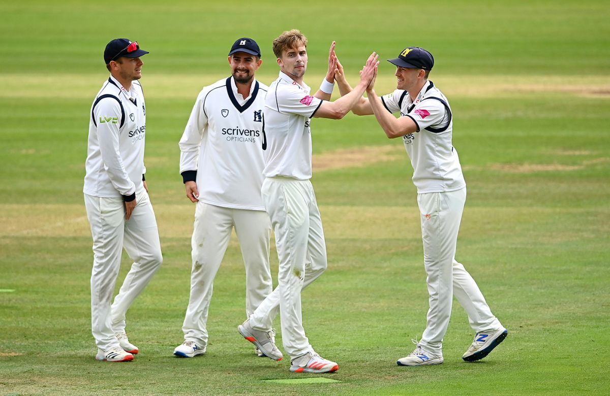 Craig Miles stoops for a low catch off his own bowling | ESPNcricinfo.com