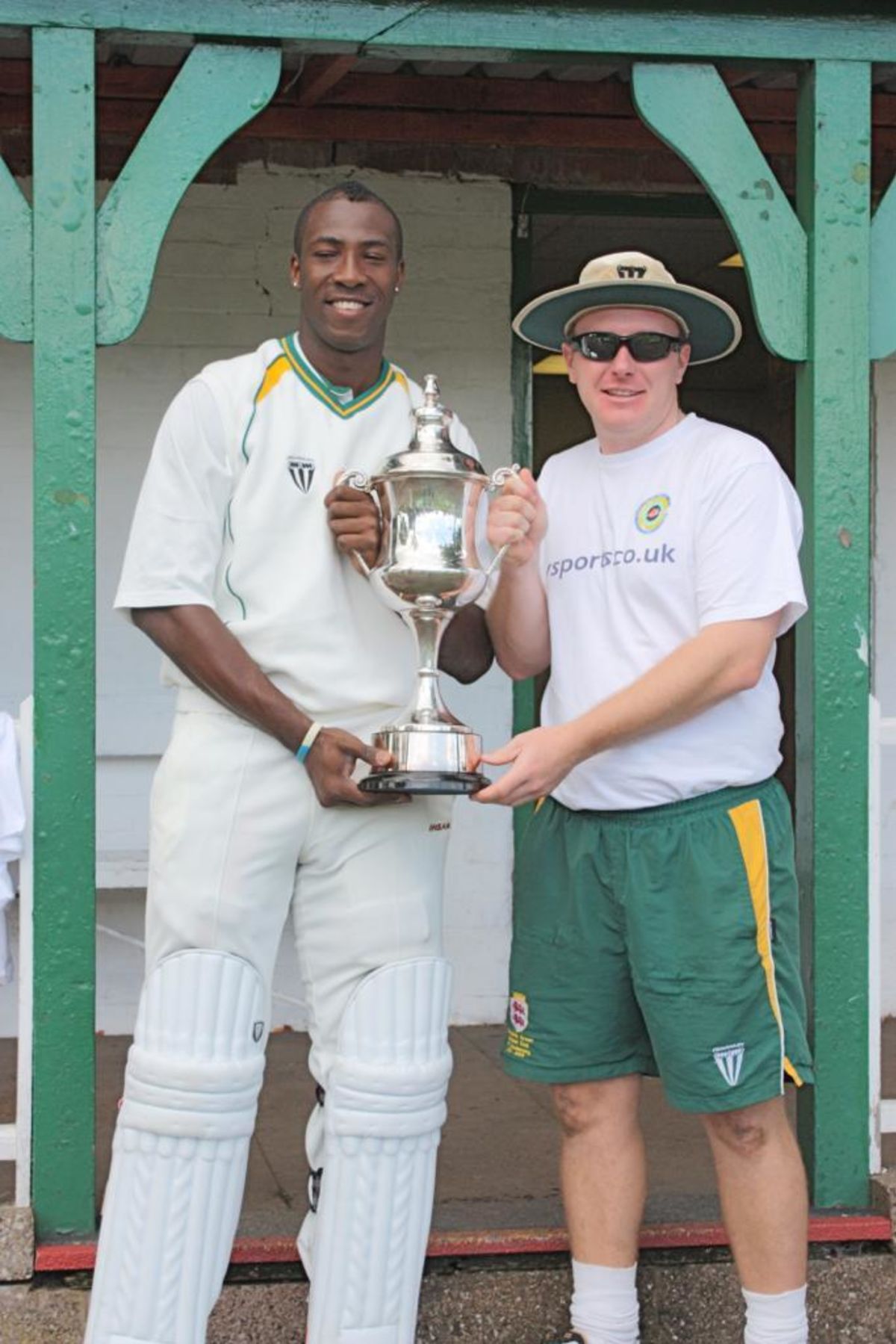Andre Russell and Tim Williams hold the trophy | ESPNcricinfo.com