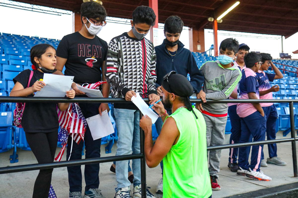 USA player Jessy Singh poses for pictures with fans after the win over ...