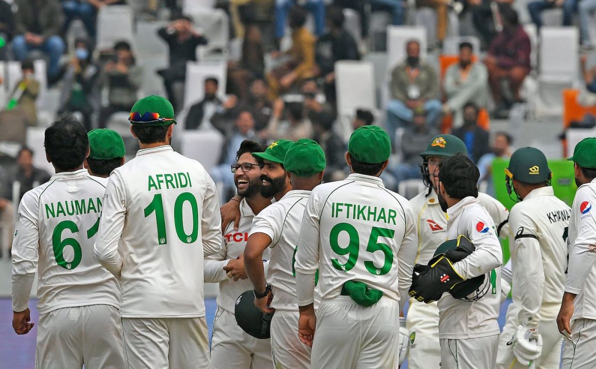 Nauman Ali celebrates the wicket of Usman Khawaja with his team-mates ...