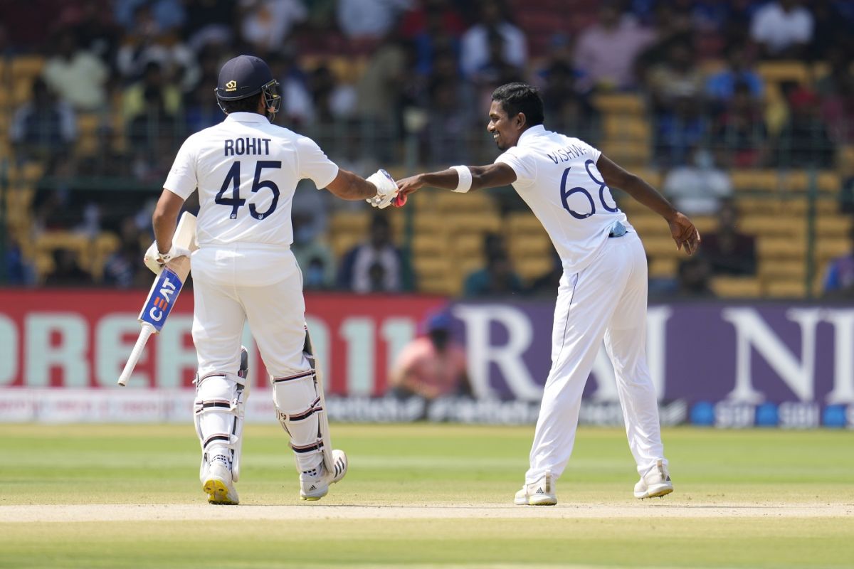 Rohit Sharma fist-bumps Vishwa Fernando after pulling out at the last ...