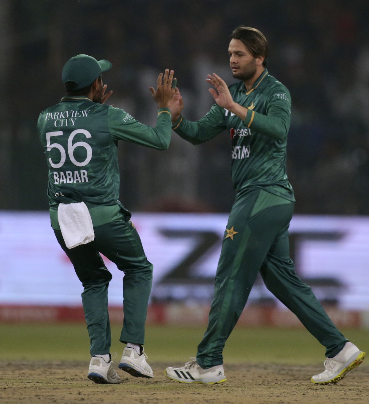 The Pakistan players celebrate the fall of Travis Head | ESPNcricinfo.com