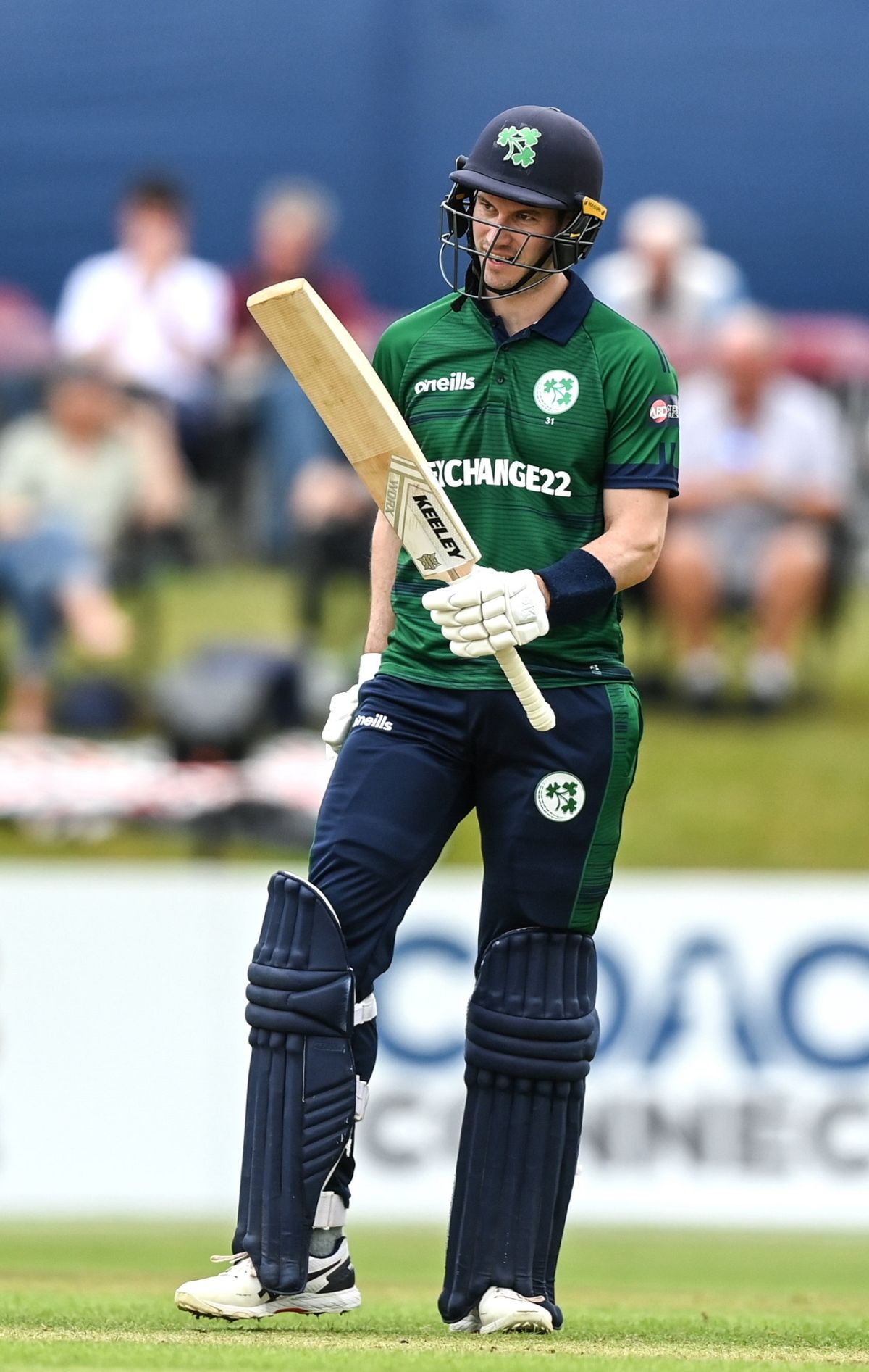 George Dockrell raises his bat after his half-century | ESPNcricinfo.com