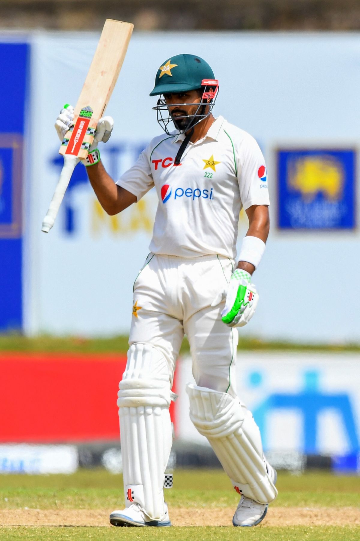 Babar Azam Raises His Bat After Completing His 22nd Test Half Century