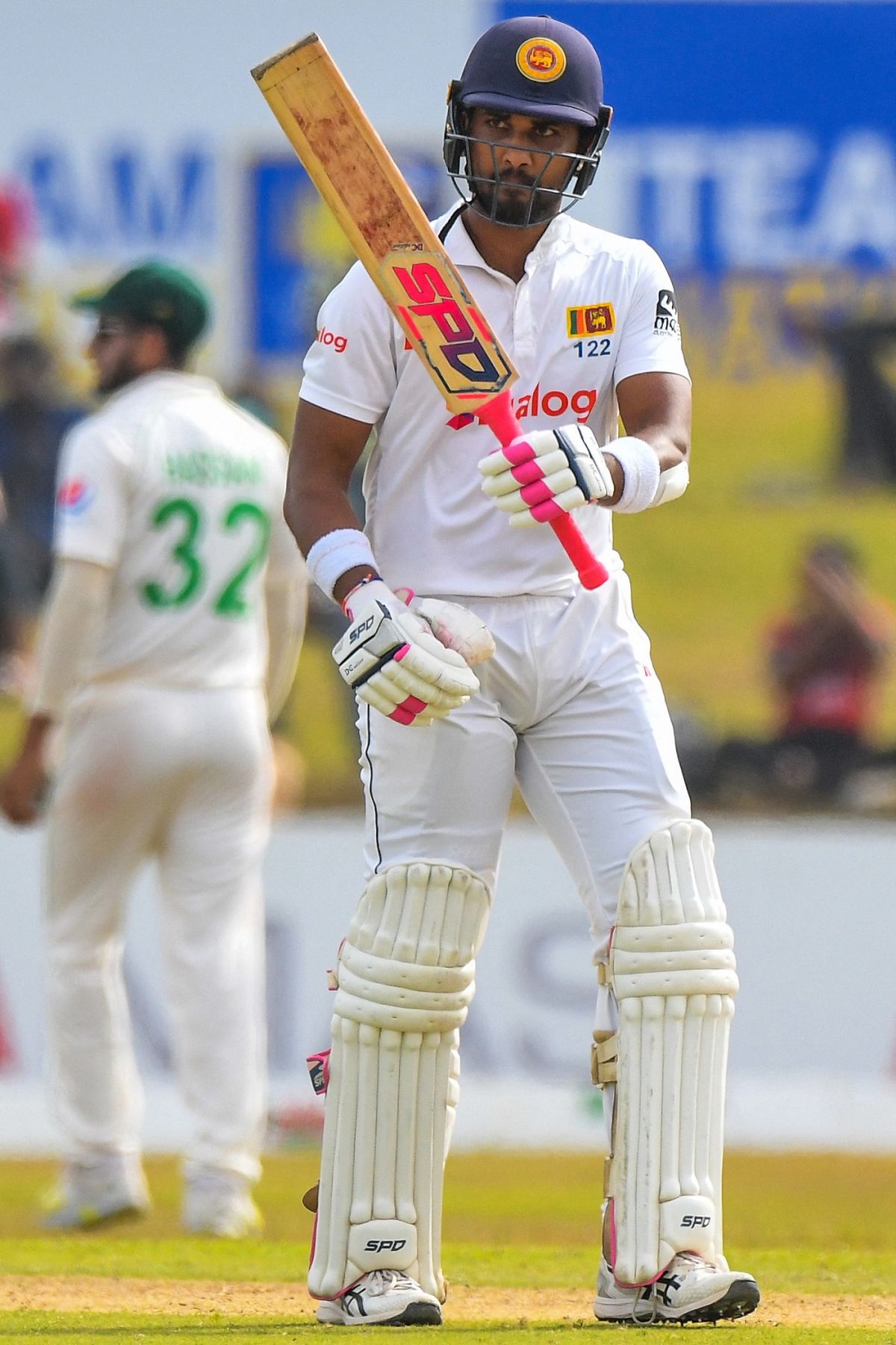 Dinesh Chandimal raises his bat after getting to fifty | ESPNcricinfo.com