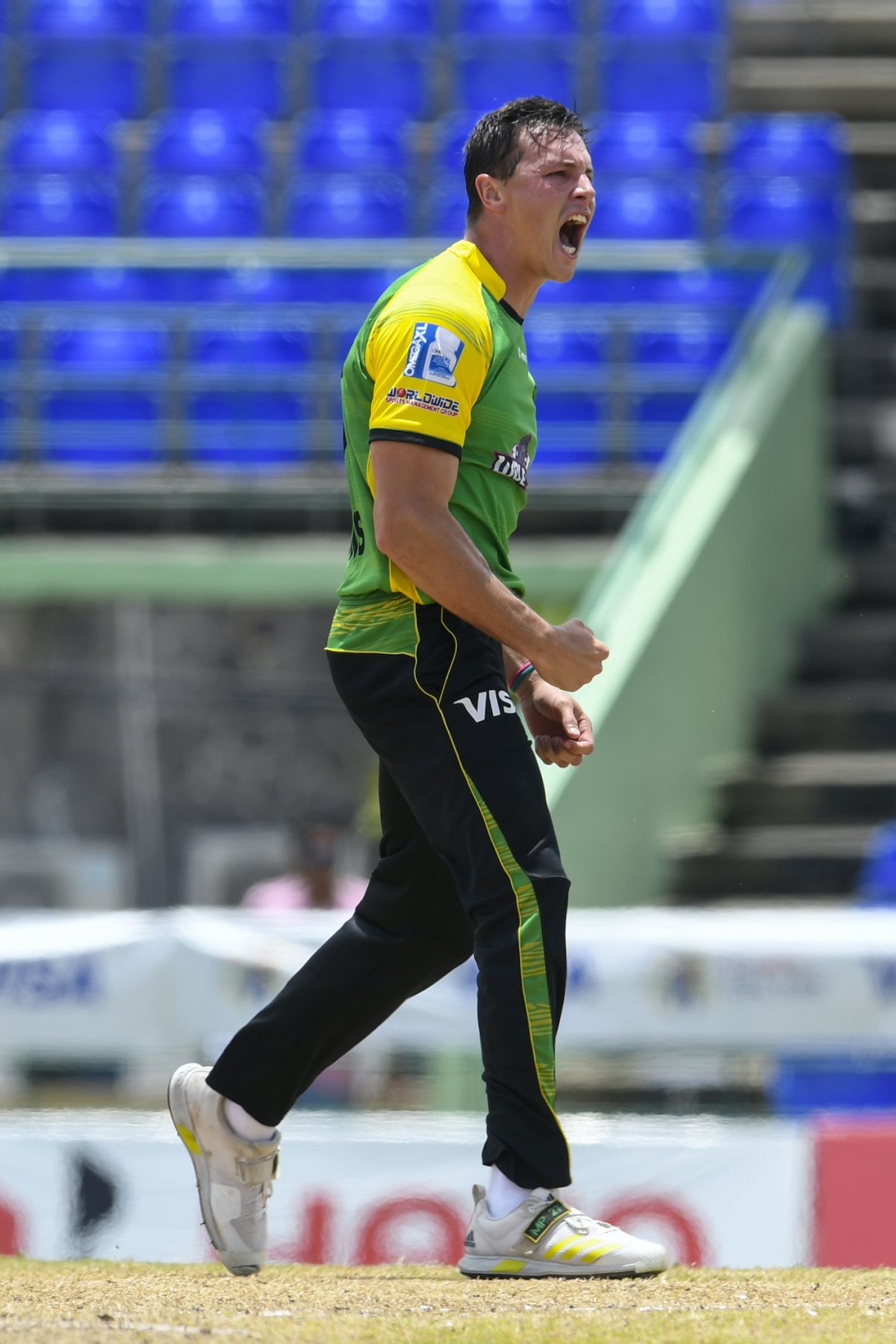 Migael Pretorius celebrates upon picking up Romario Shepherd's wicket ...