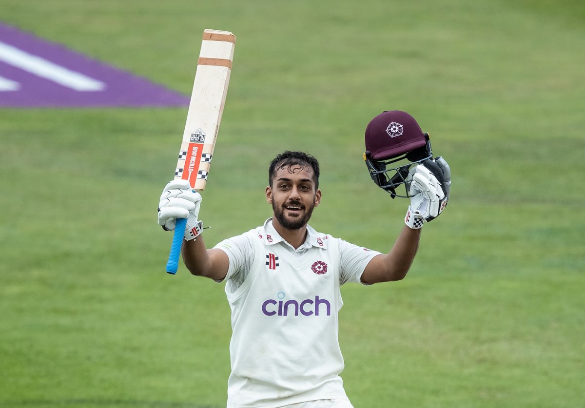 Saif Zaib raises his bat after reaching a century | ESPNcricinfo.com