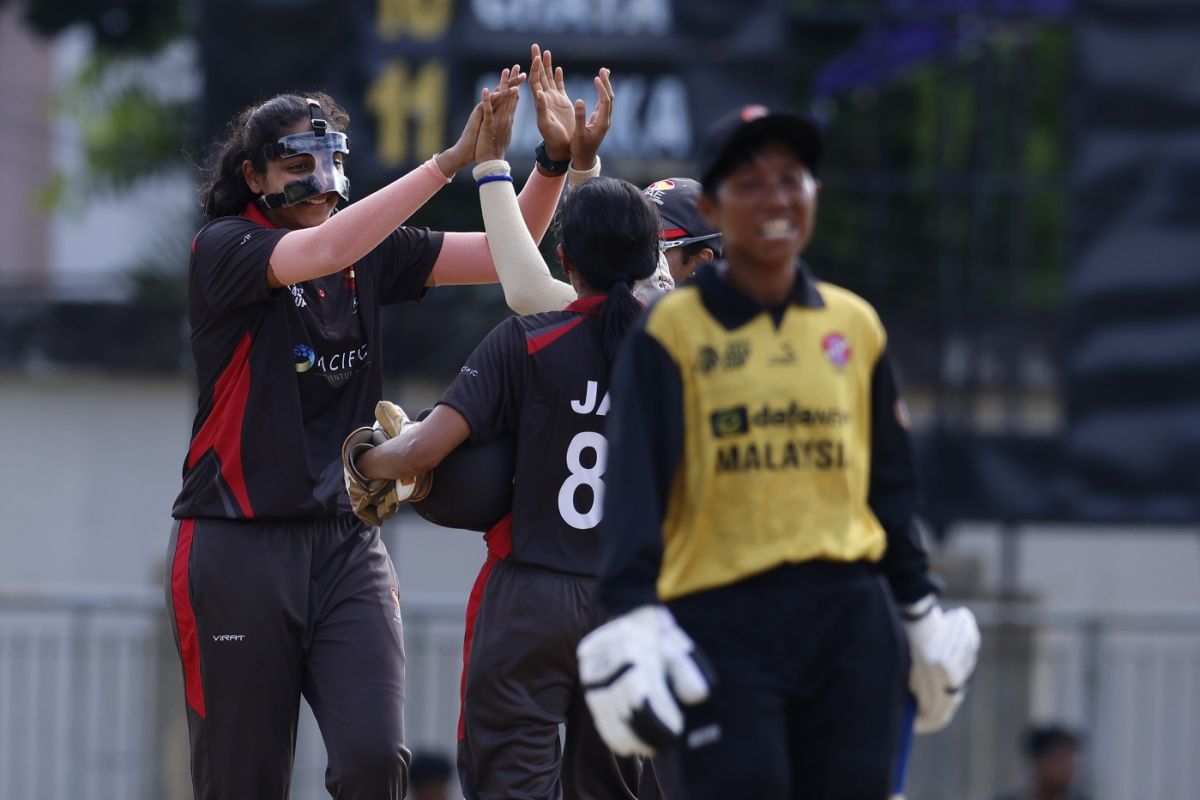 Esha Oza celebrates after dismissing Wan Julia cheaply | ESPNcricinfo.com