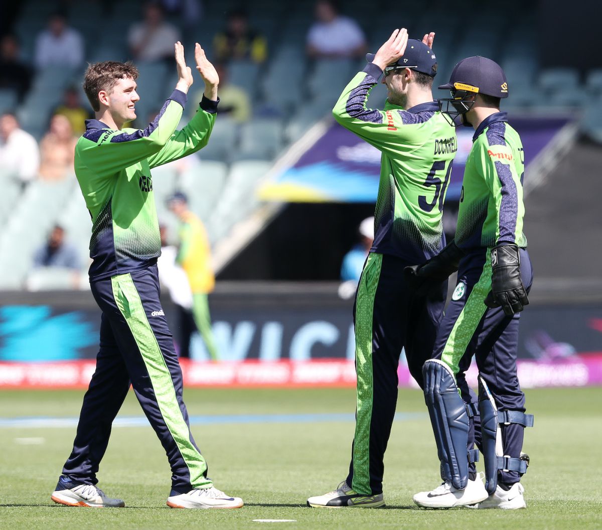 George Delany celebrates with George Dockrell | ESPNcricinfo.com