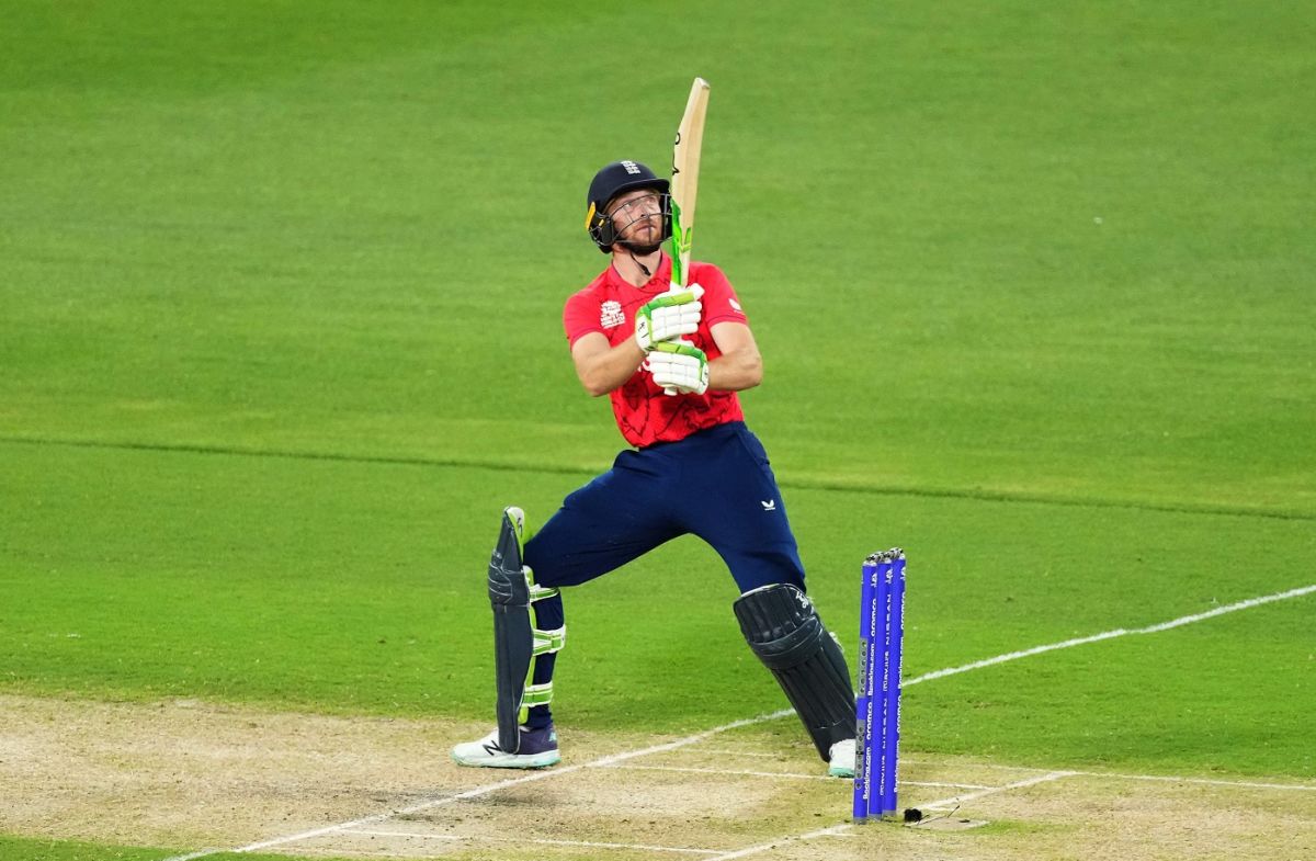 Jos Buttler scoops a length ball from Naseem Shah over fine leg ...