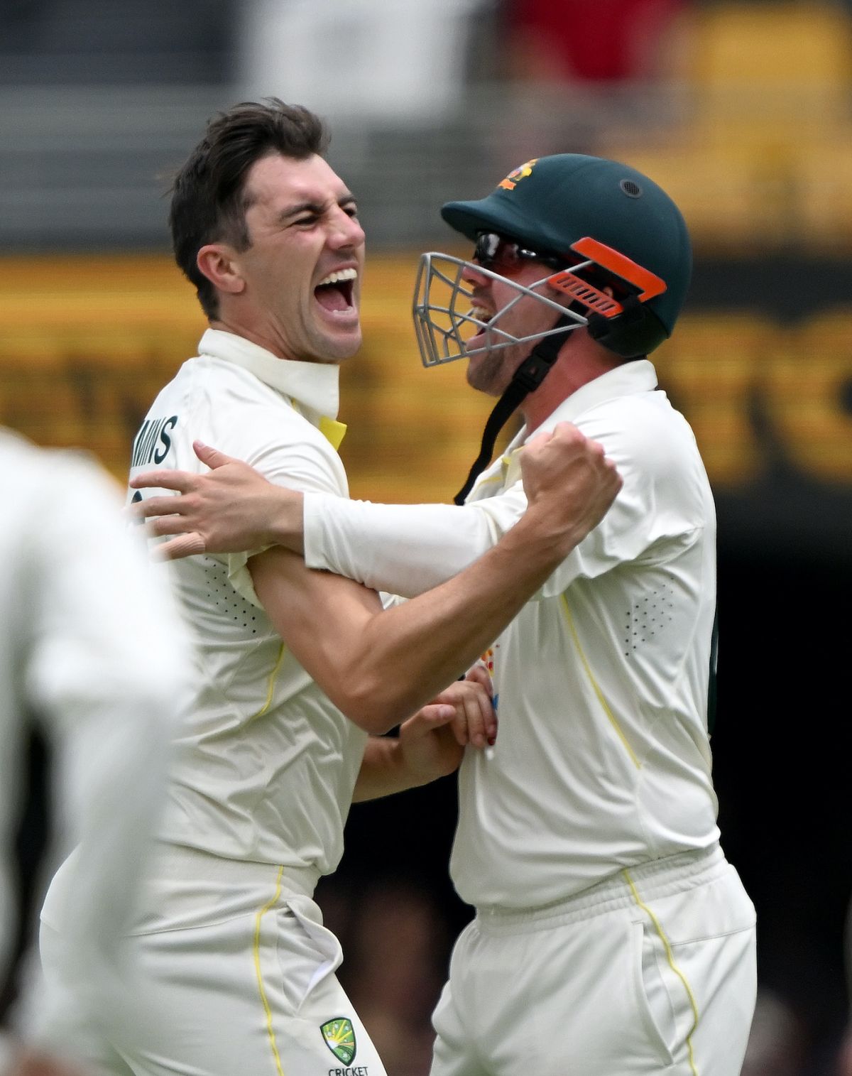 Pat Cummins and Travis Head celebrate after Dean Elgar's dismissal ...