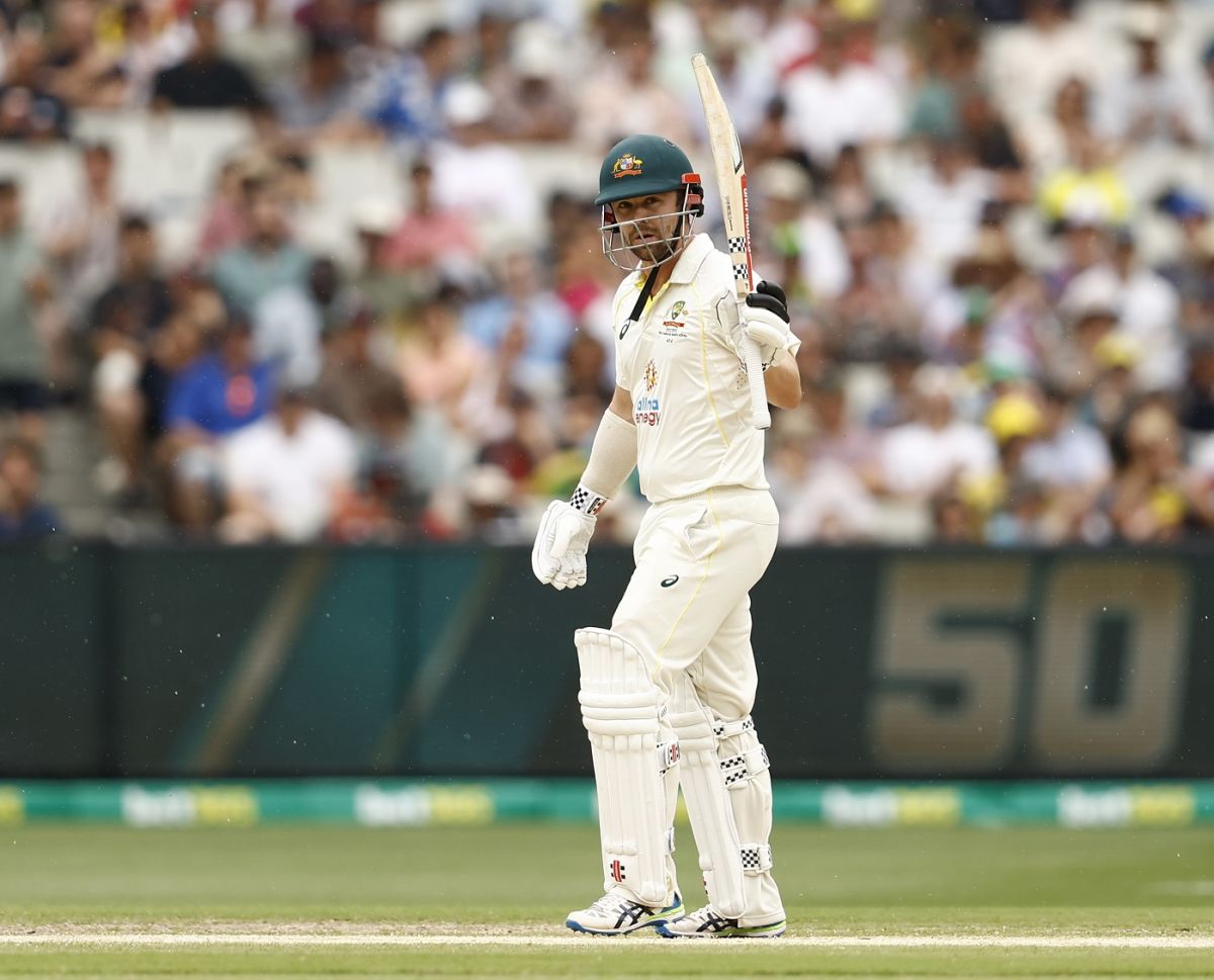 Travis Head raises his bat after reaching his fifty | ESPNcricinfo.com