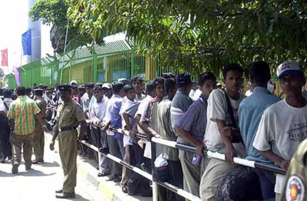 Young fans queue up by the turnstiles - nearly an all male activity ...