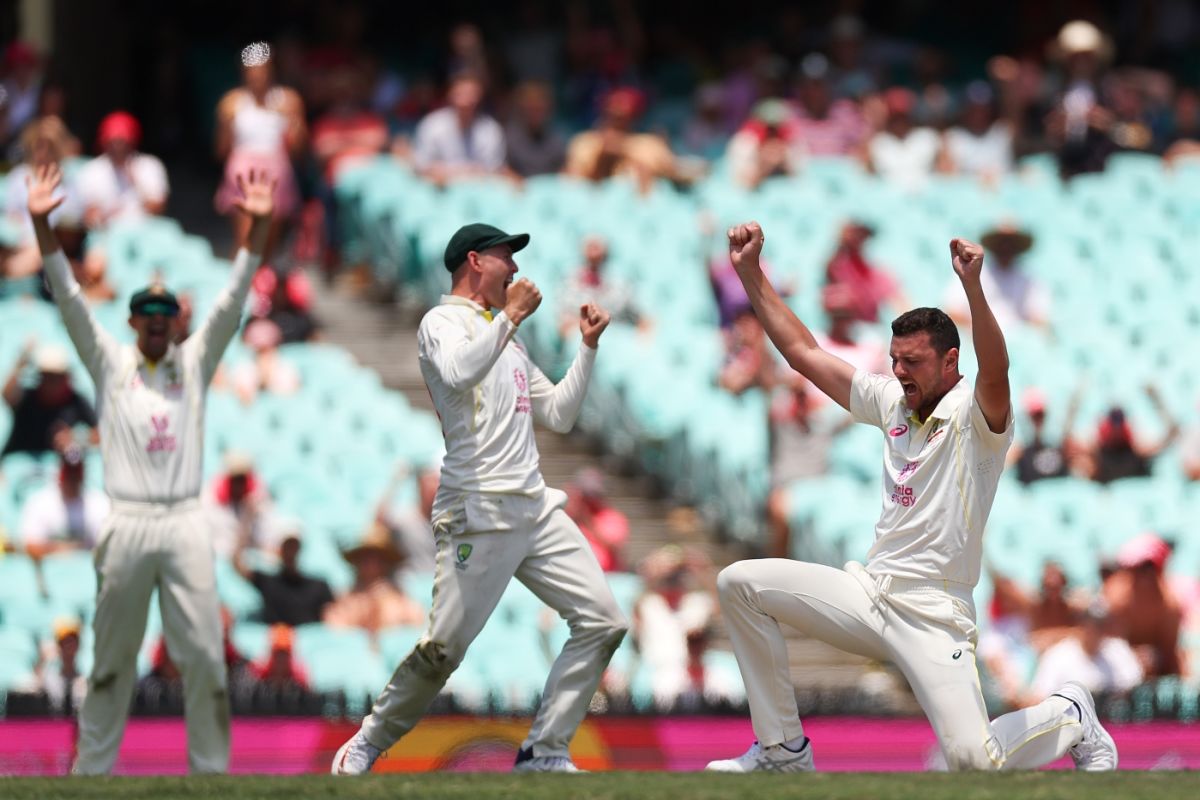 Josh Hazlewood and Marnus Labuschagne celebrate the wicket of Keshav ...