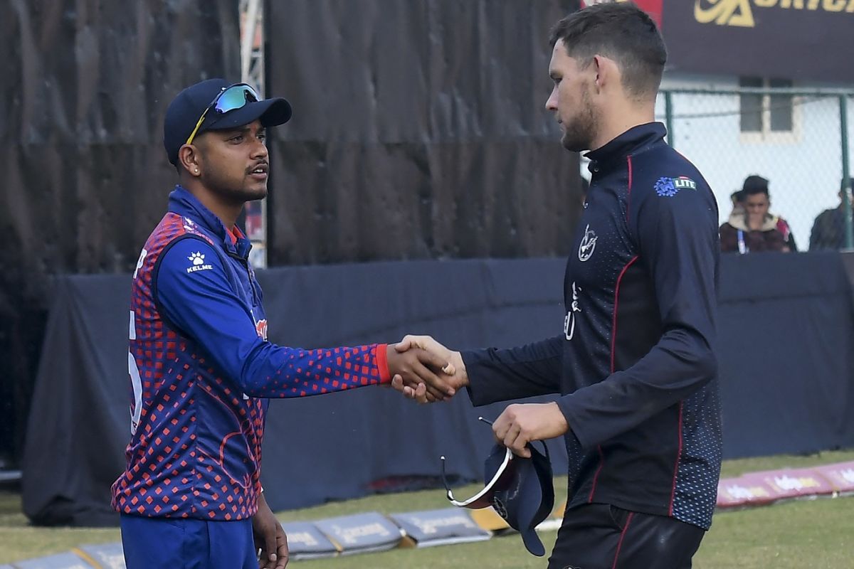 Sandeep Lamichhane shakes his hand with Gerhard Erasmus of Namibia ...