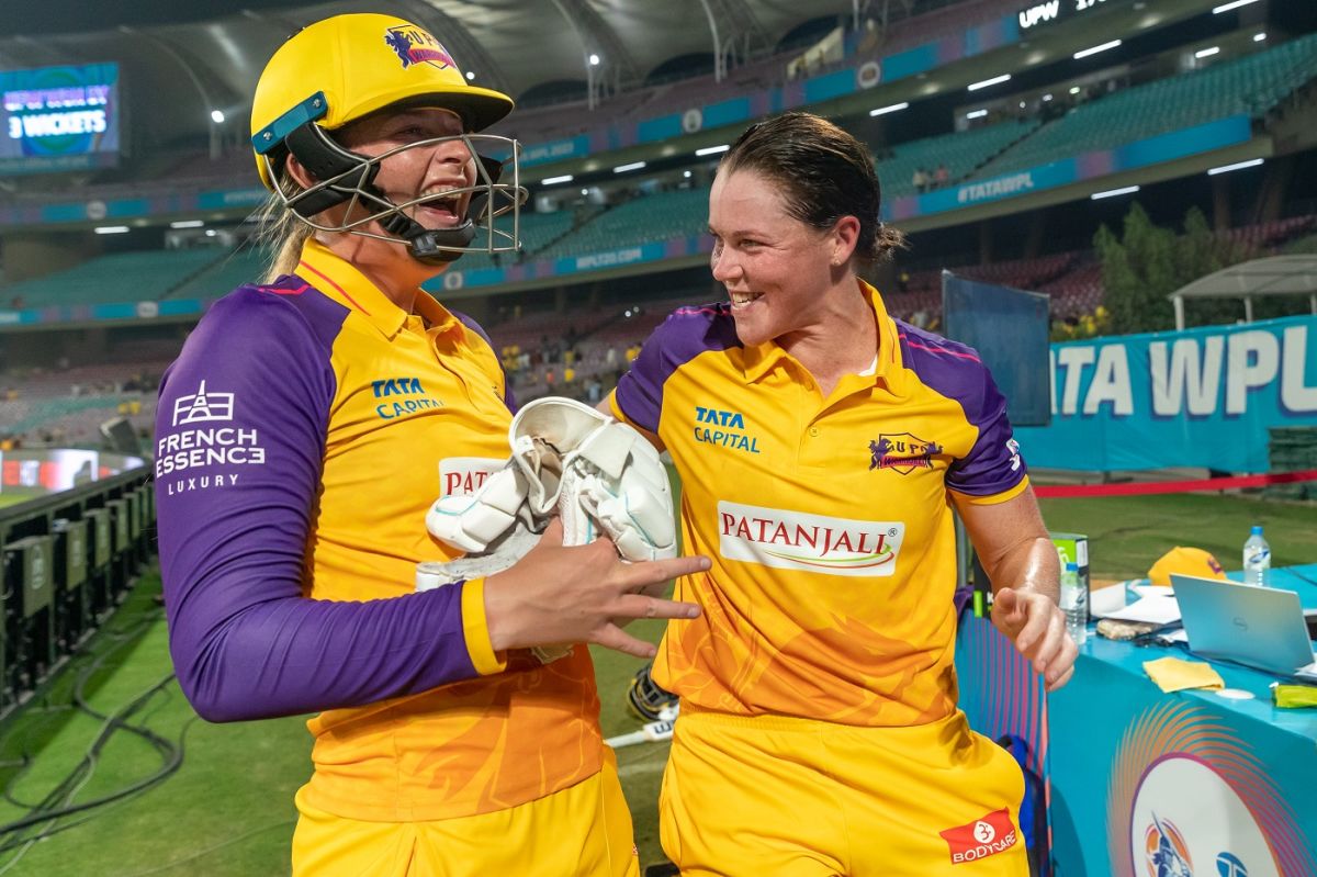 Grace Harris and Sophie Ecclestone celebrate after the win ...