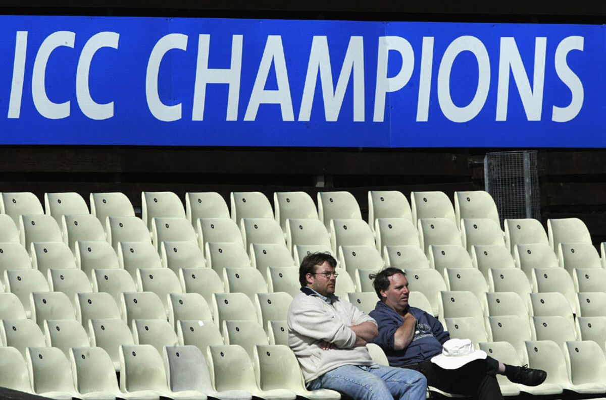 Two spectators surrounded by empty seats | ESPNcricinfo.com
