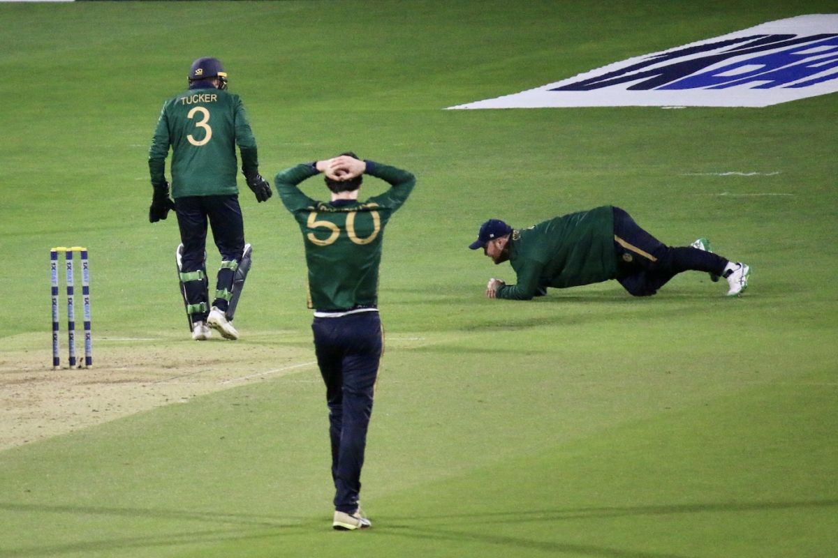 Lorcan Tucker checks up on Paul Stirling, who was hit in the face by a ...