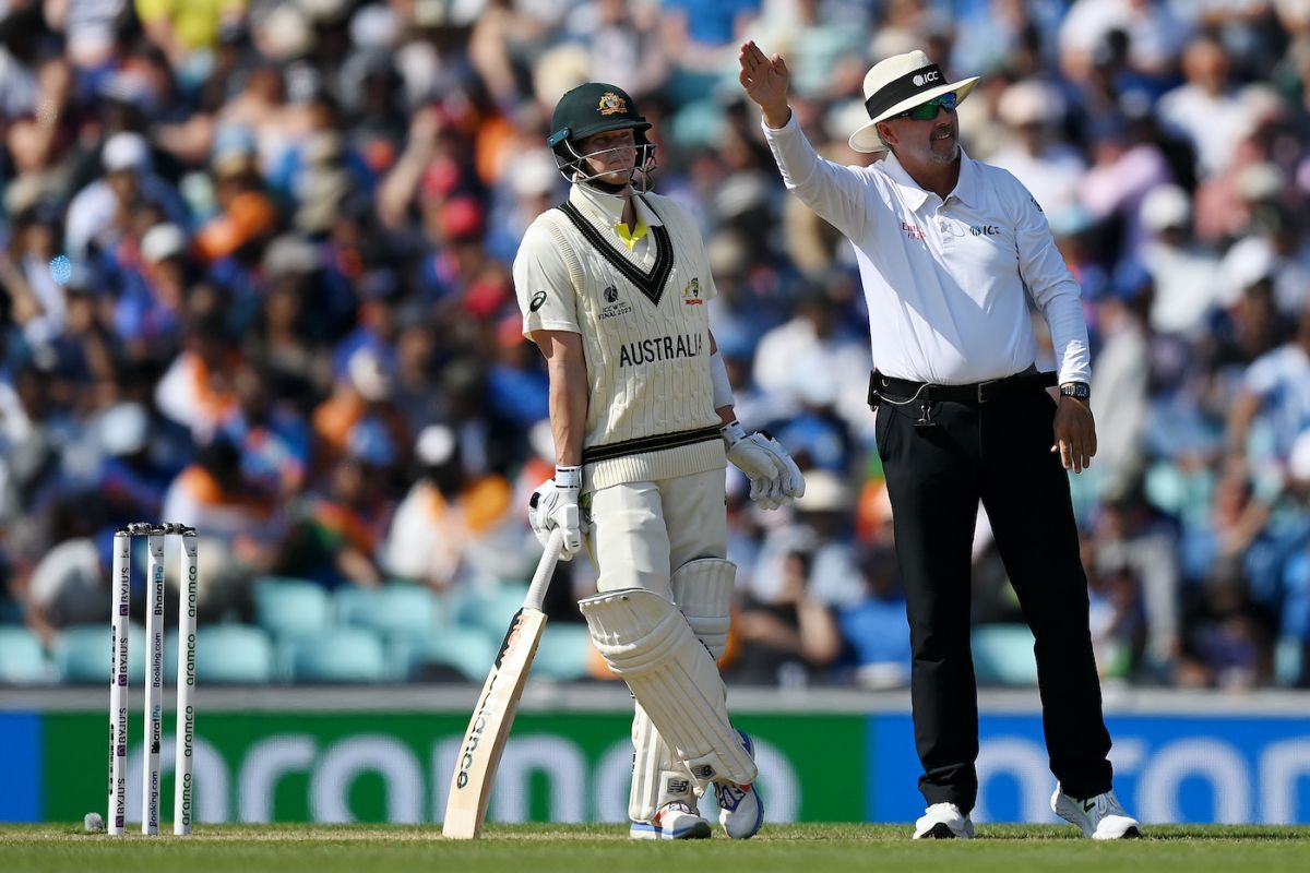 Richard Illingworth helps clear up the movement behind the sightscreen ...