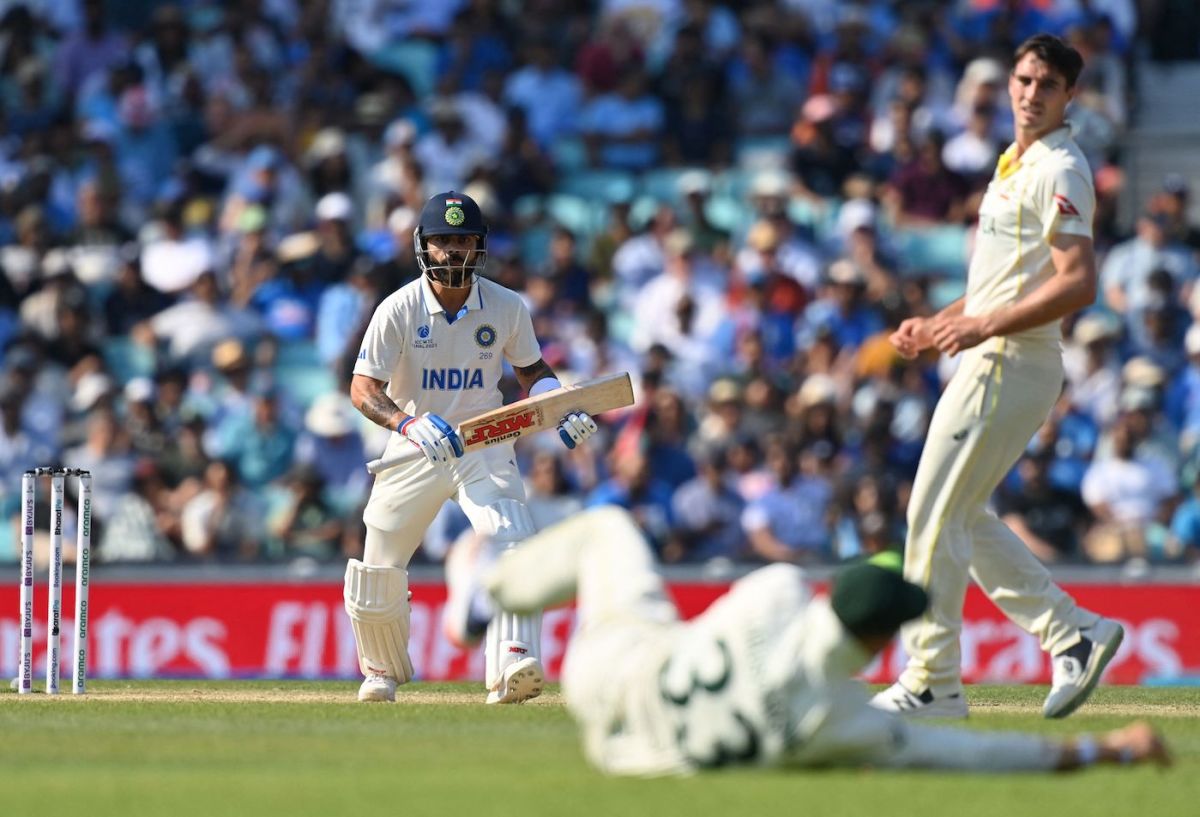 Virat Kohli and Pat Cummins see if the fielder at mid-off has stopped ...