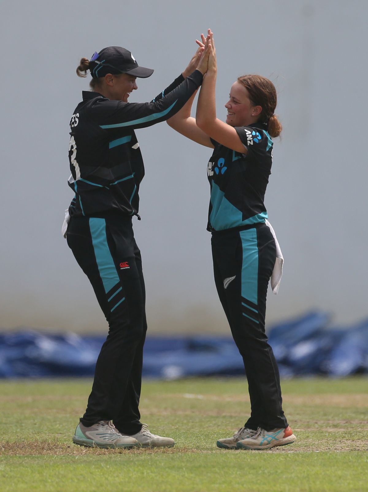 Eden Carson celebrates one of her wickets with Suzie Bates ...