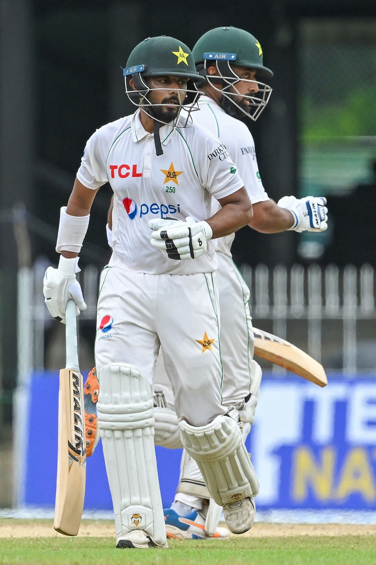 Saud Shakeel and Abdullah Shafique run between the wickets ...