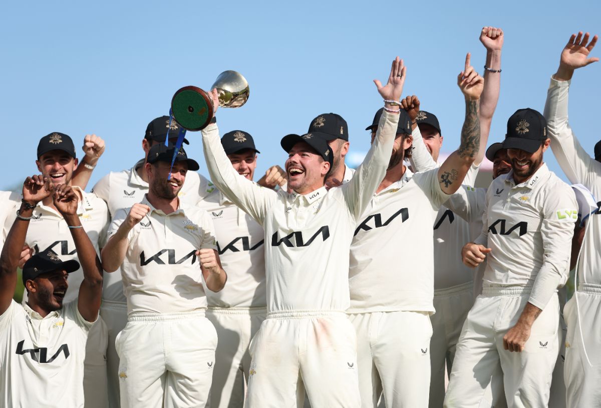 Rory Burns poses with the County Championship trophy after captaining ...