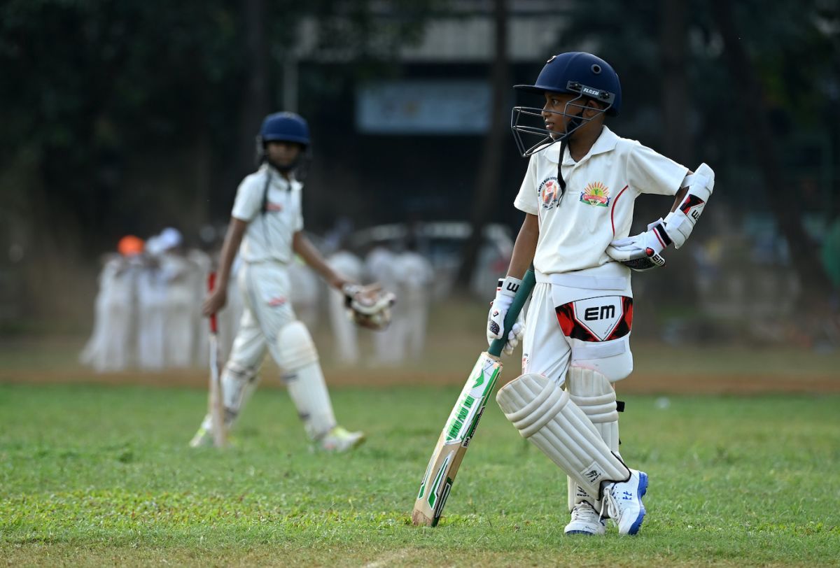 The umpire offers peace as a left-armer runs in at Mumbai's Azad Maidan ...