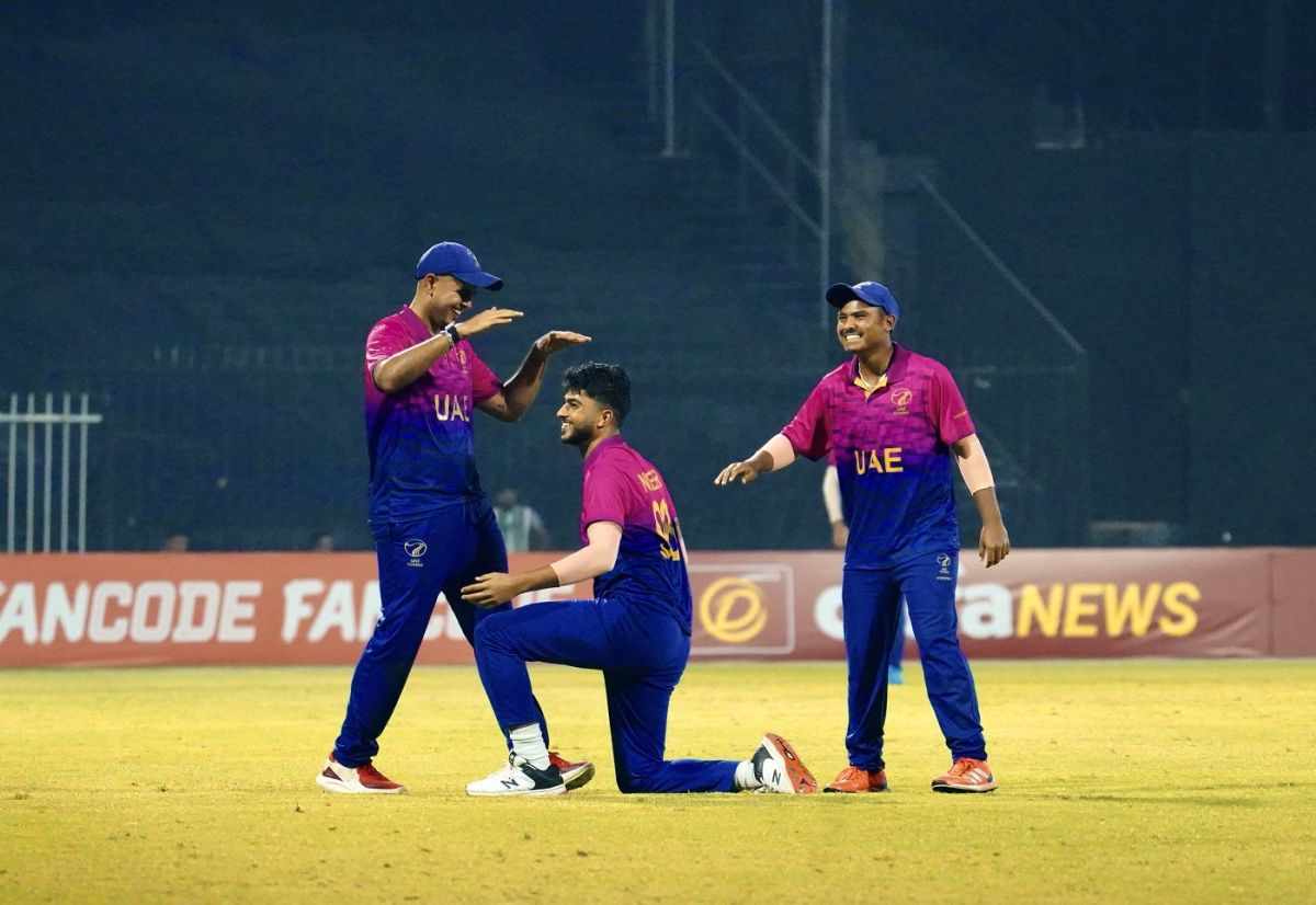 Ibrahim Zadran and Muhammad Waseem pose with the T20I series trophy ...