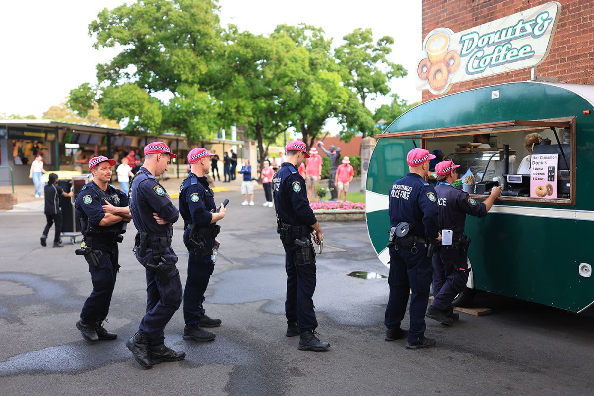 Police queue for their morning coffee wearing pink caps | ESPNcricinfo.com