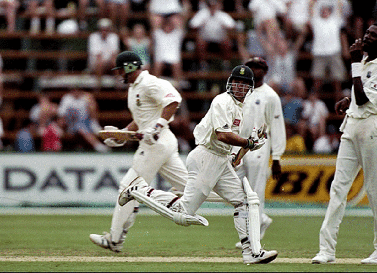 A South African spectator wearing a Springbok cap watches at the ...