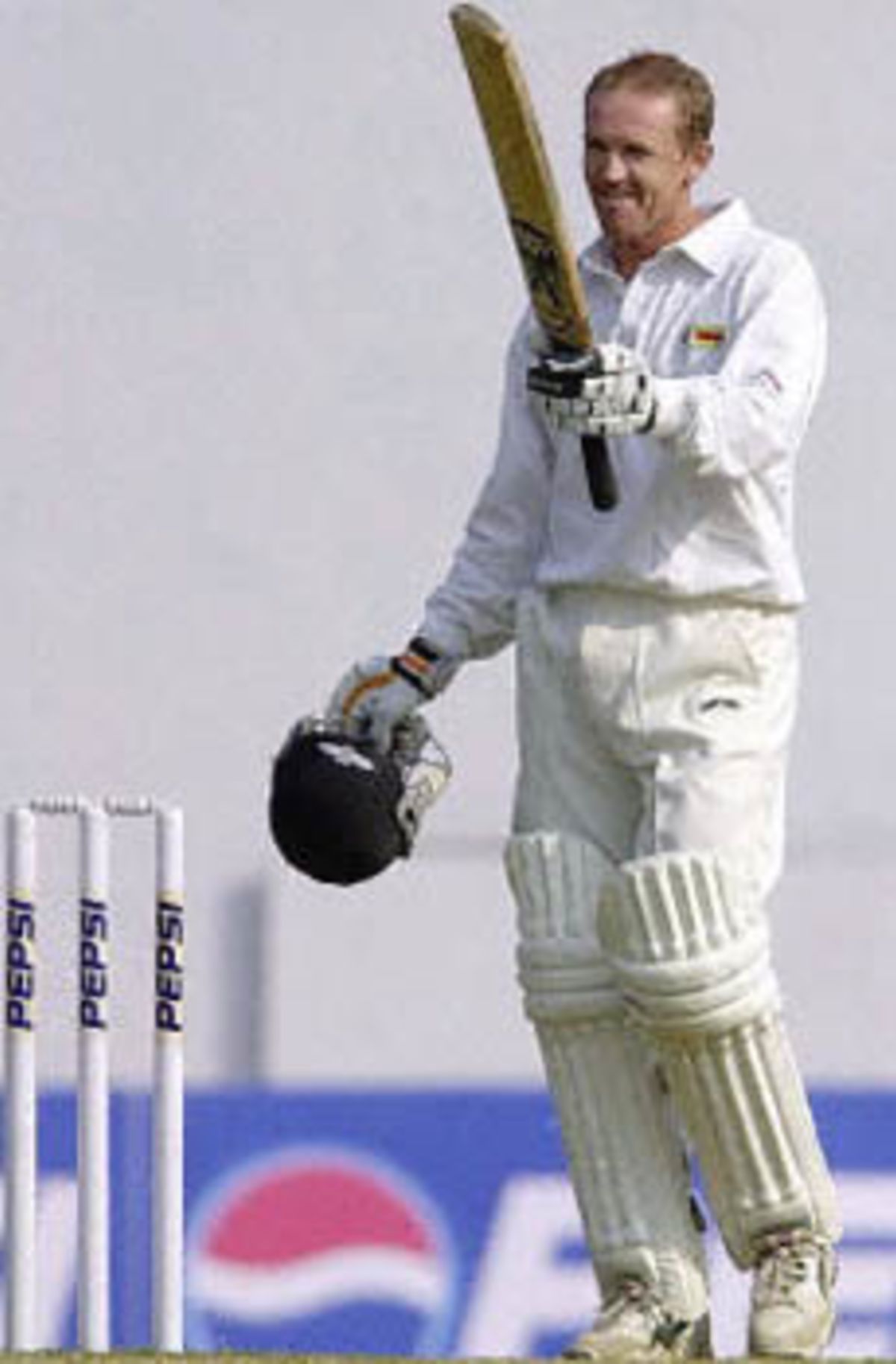 Andy Flower acknowledges the crowd as he reaches his century ...