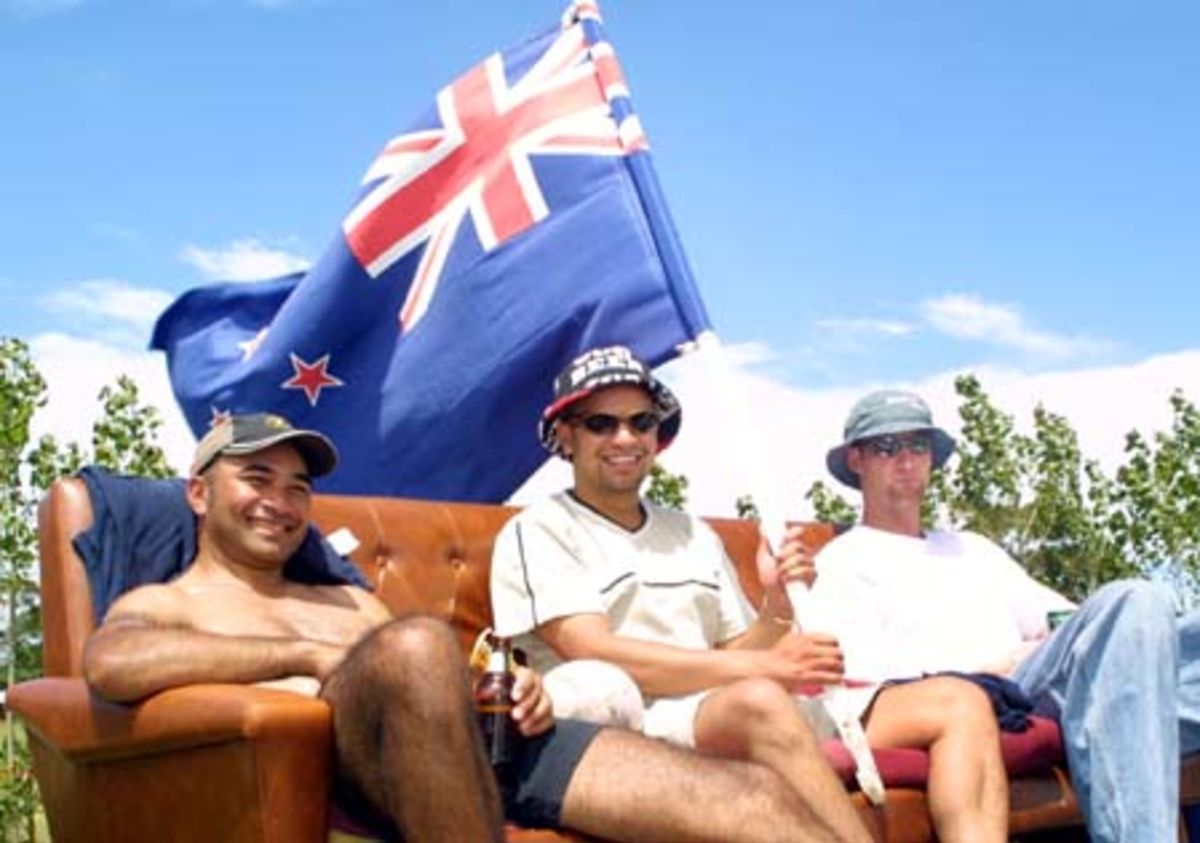 Anne Linehan raises her bat after she reaches a half-century ...